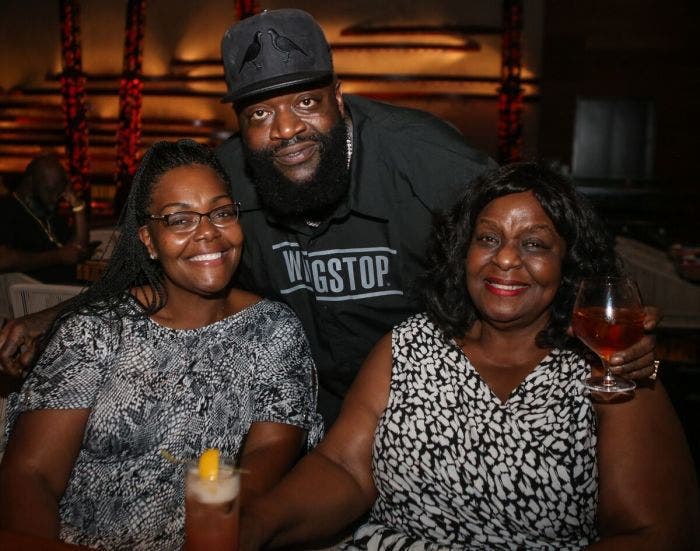 Rick Ross celebrates another sales milestone with Wingstop staff