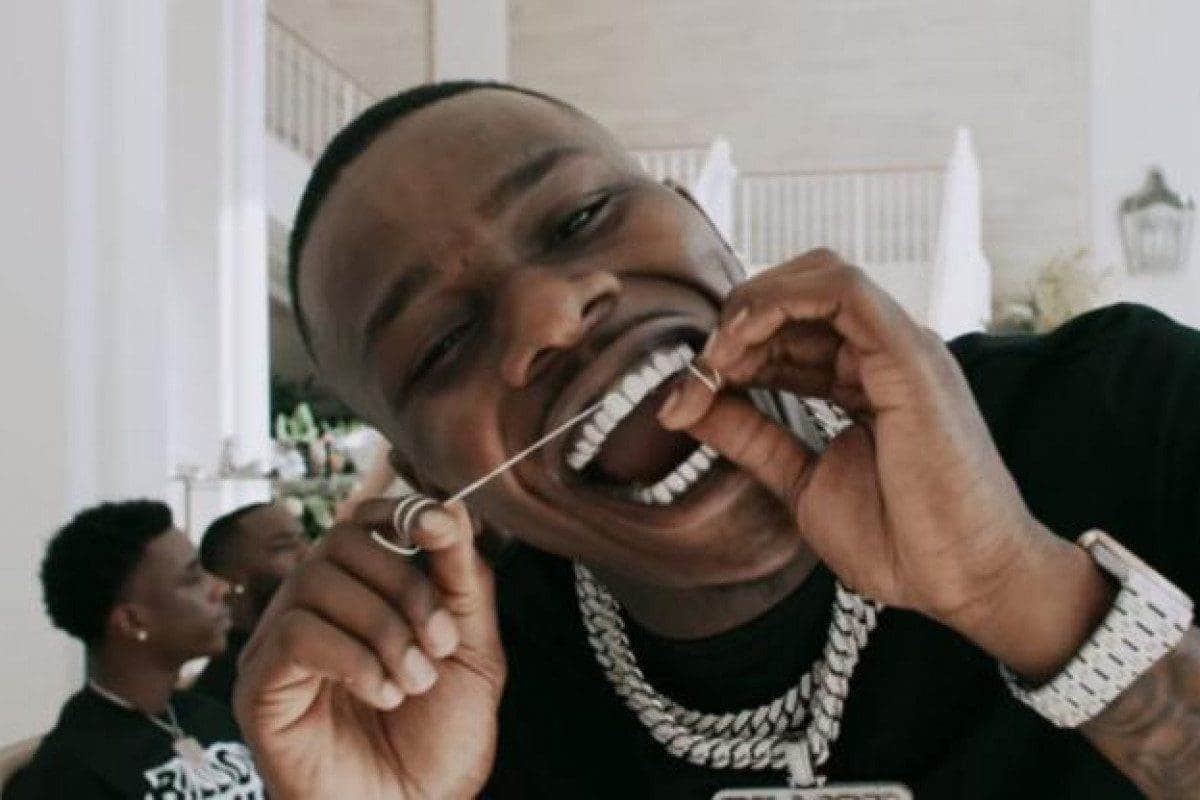 DaBaby seen punching fan who reached for his chain