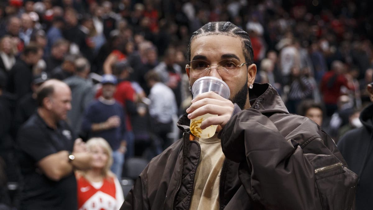 Twitter reacts to viral video of Drake taking shots with fans at local bar