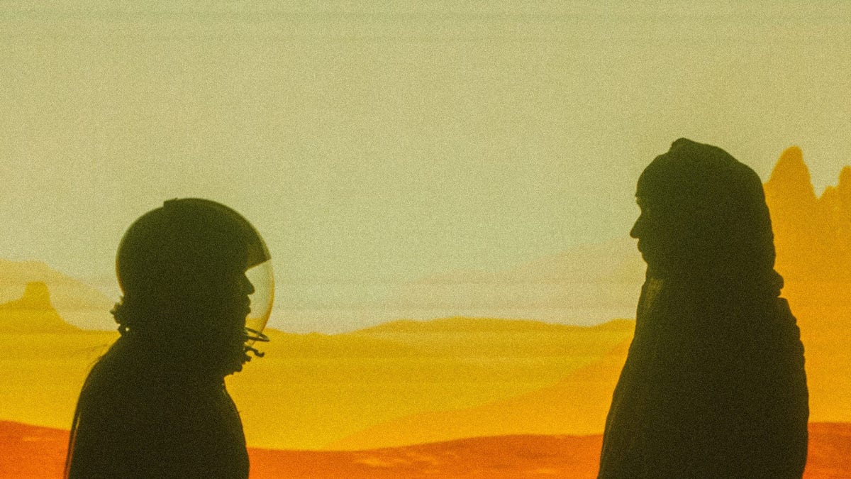 Kaash Paige and 6lack head into space in new "Miss My Dawgs" video